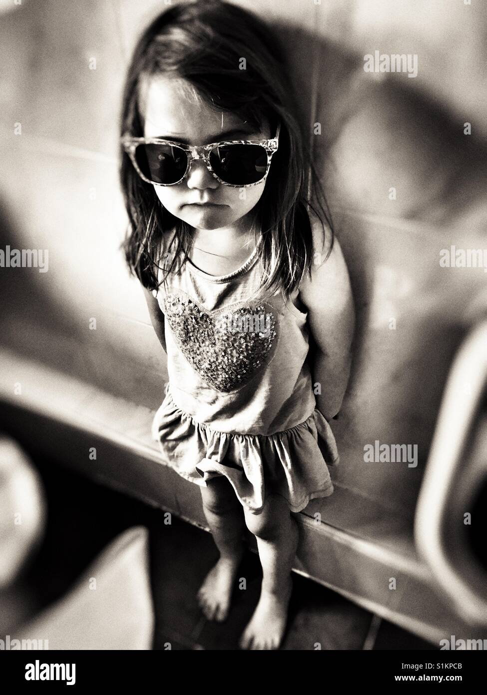 Young girl being grumpy Stock Photo - Alamy