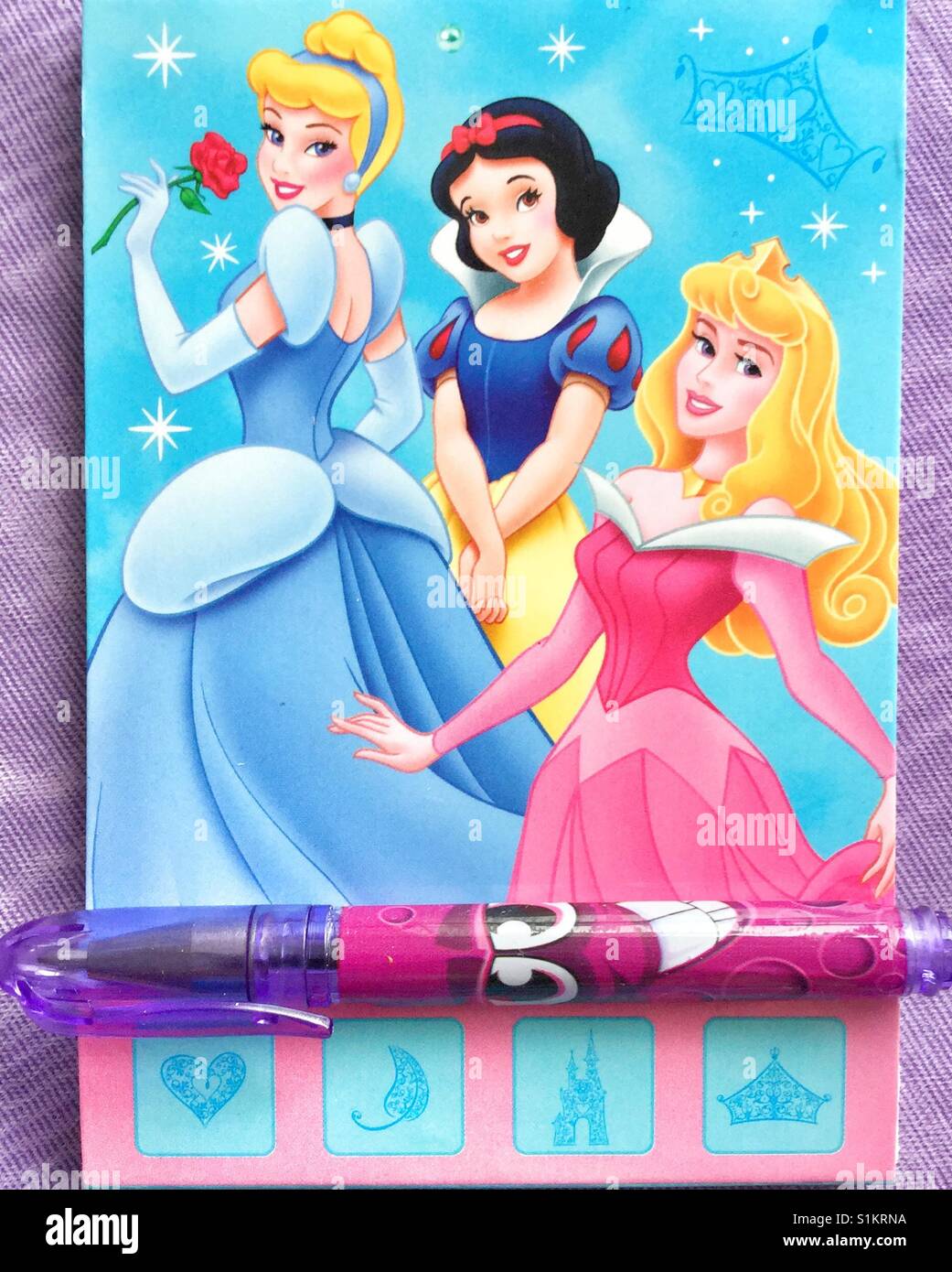 Disney Princesses notepad and pen Stock Photo - Alamy