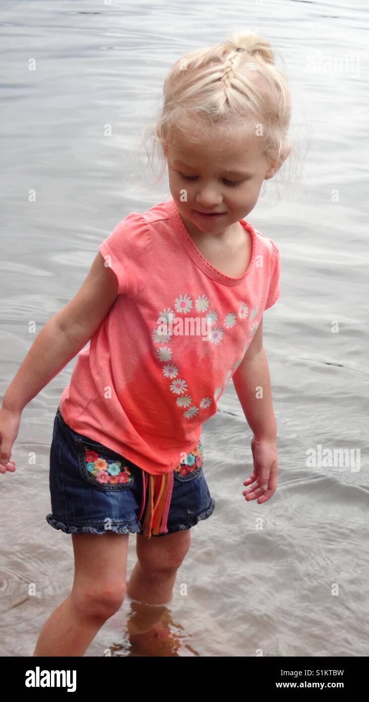 Child wading water hi-res stock photography and images - Alamy