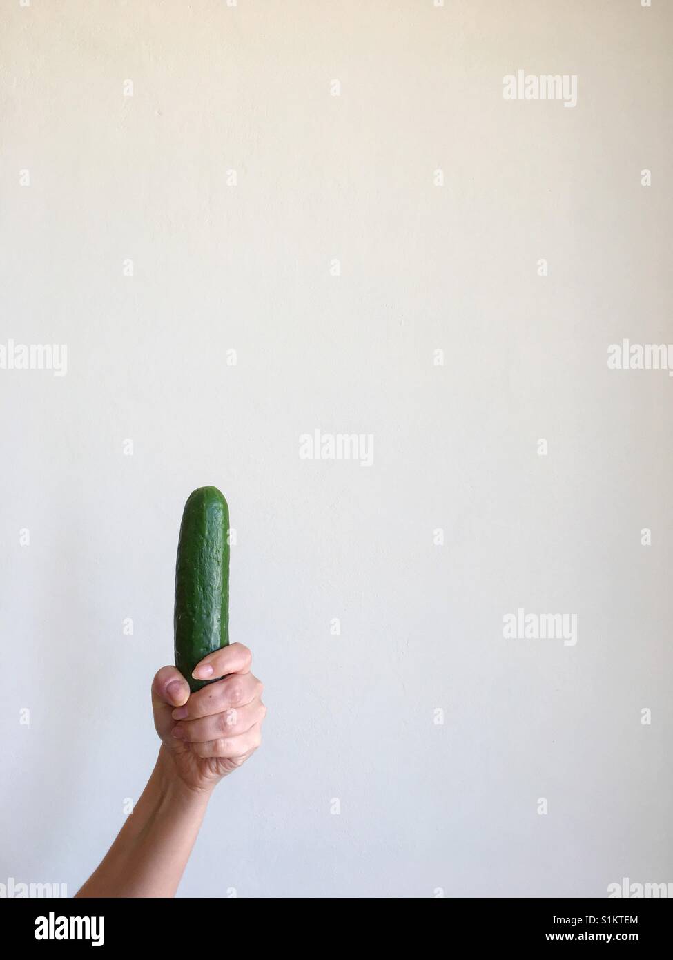 Cucumber hand hi-res stock photography and images - Alamy
