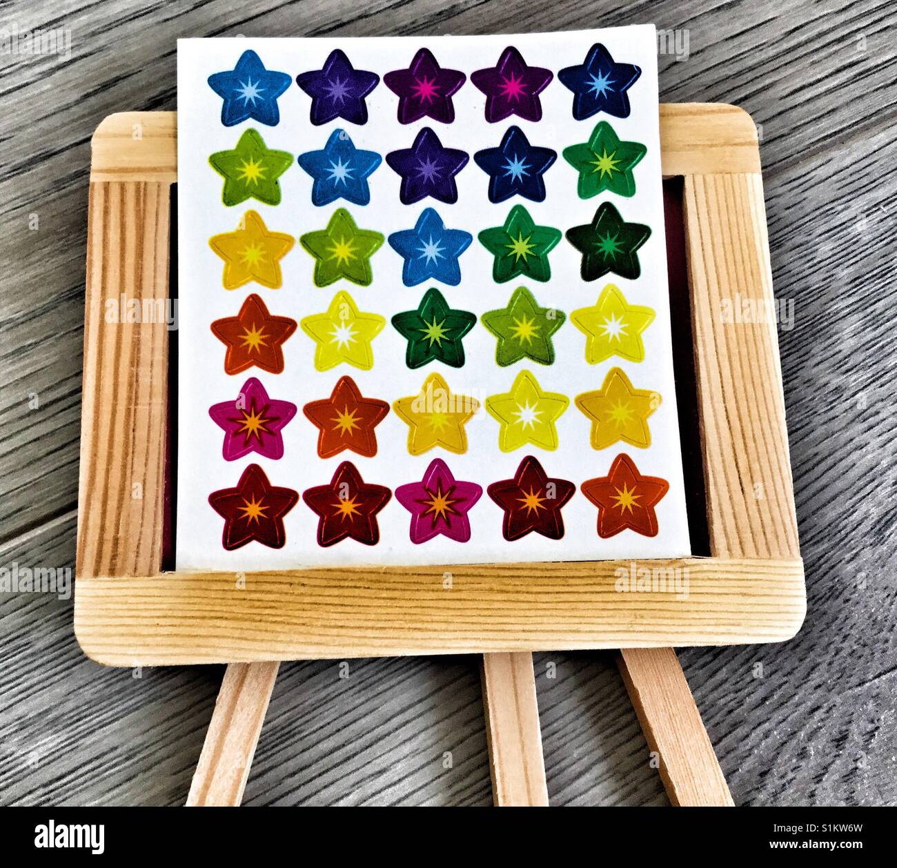 Miniature chalkboard with colourful star stickers Stock Photo - Alamy
