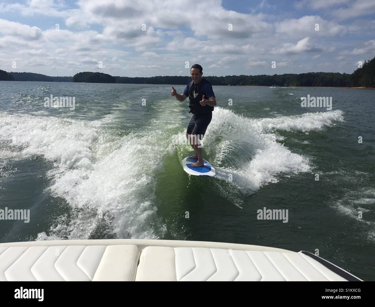 Surfing boat hi-res stock photography and images - Alamy