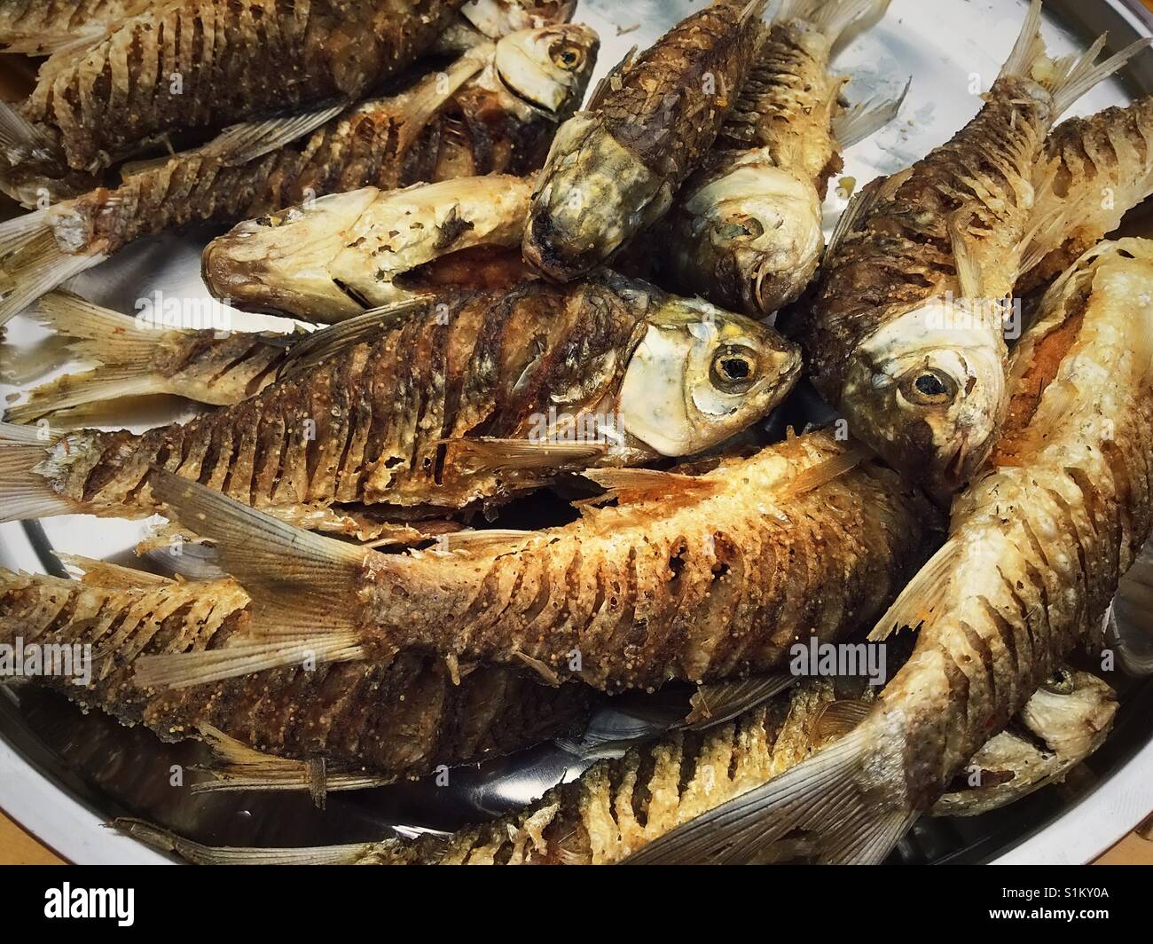 Small fried fish hi-res stock photography and images - Alamy