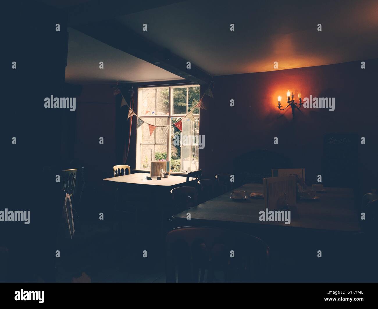 Light from a window into a dark room Stock Photo - Alamy