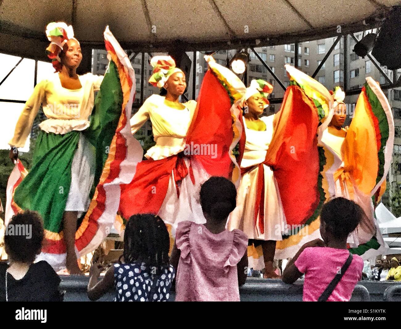 Female Caribbean dancers performing at a festival Stock Photo - Alamy