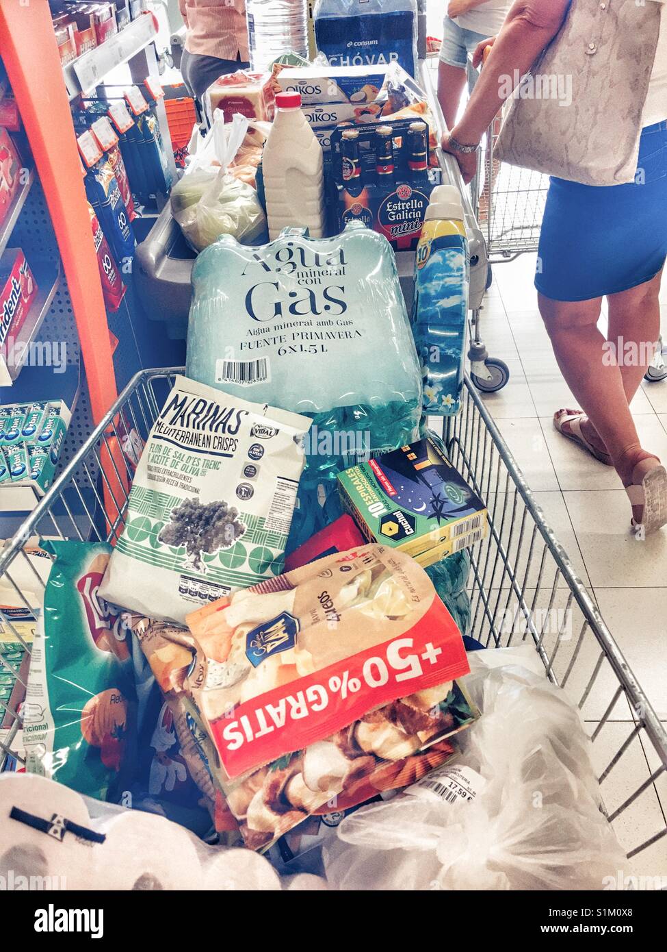 Check-out queue at a Spanish supermarket in the summer Stock Photo - Alamy