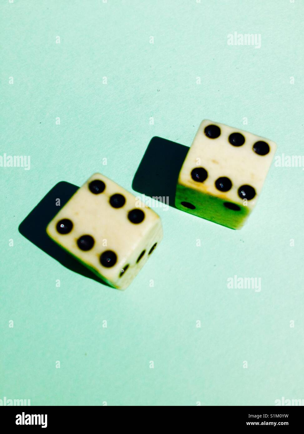 Two lucky six dice / due showing 6 dots for a high score and good luck ...