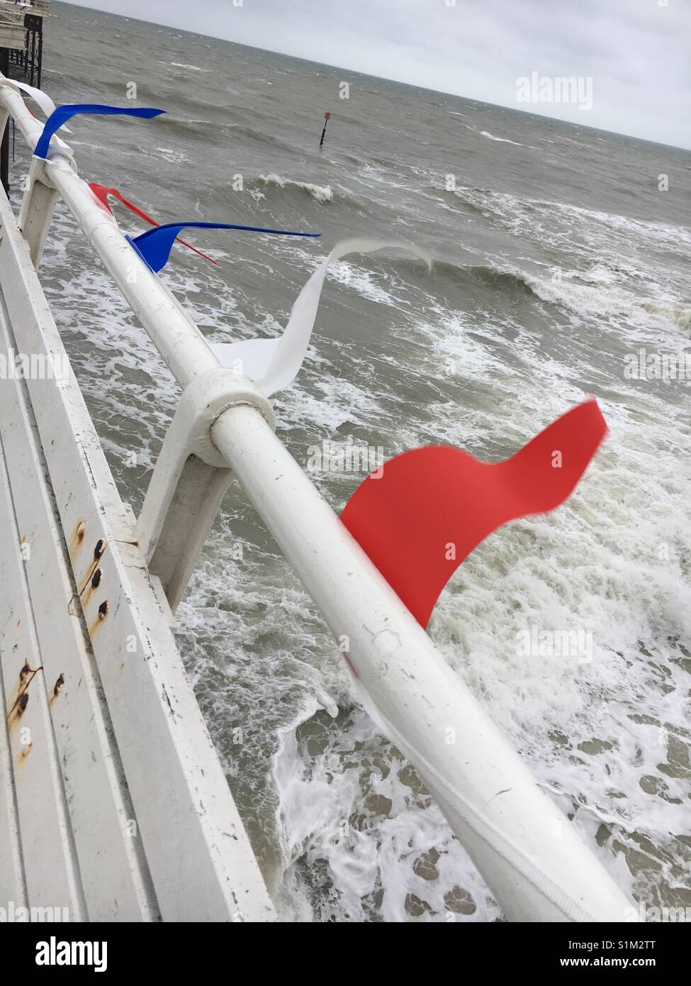 Windy flags hi-res stock photography and images - Alamy