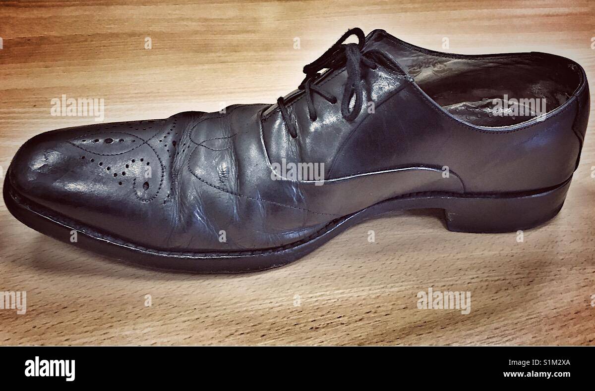 Single black shoe Stock Photo - Alamy