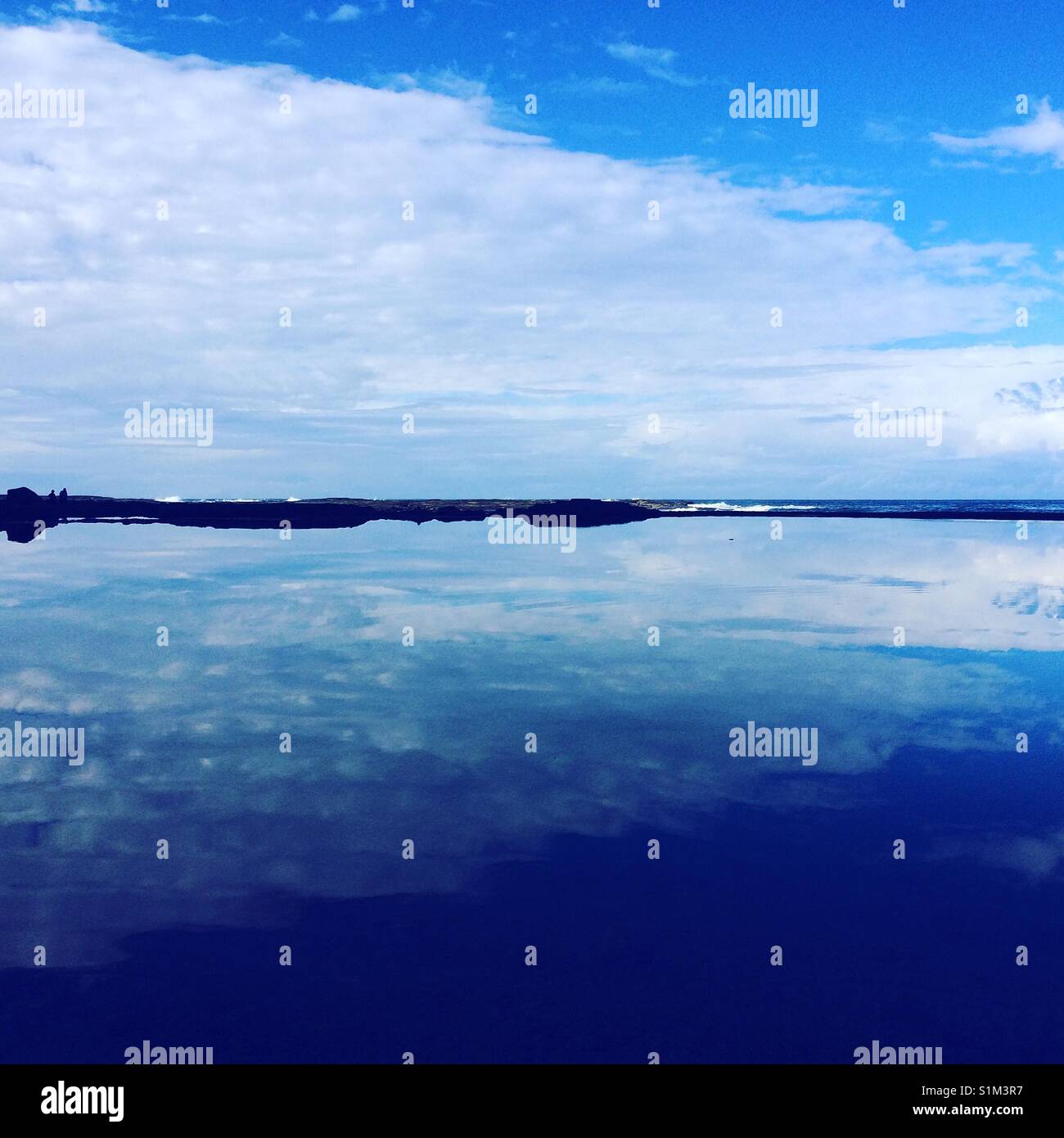 Where sea meets land meets sky Stock Photo - Alamy