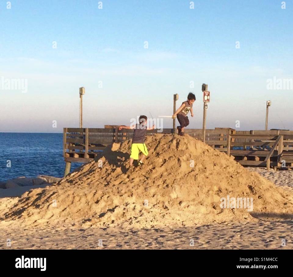Boys playing at the beach Stock Photo - Alamy