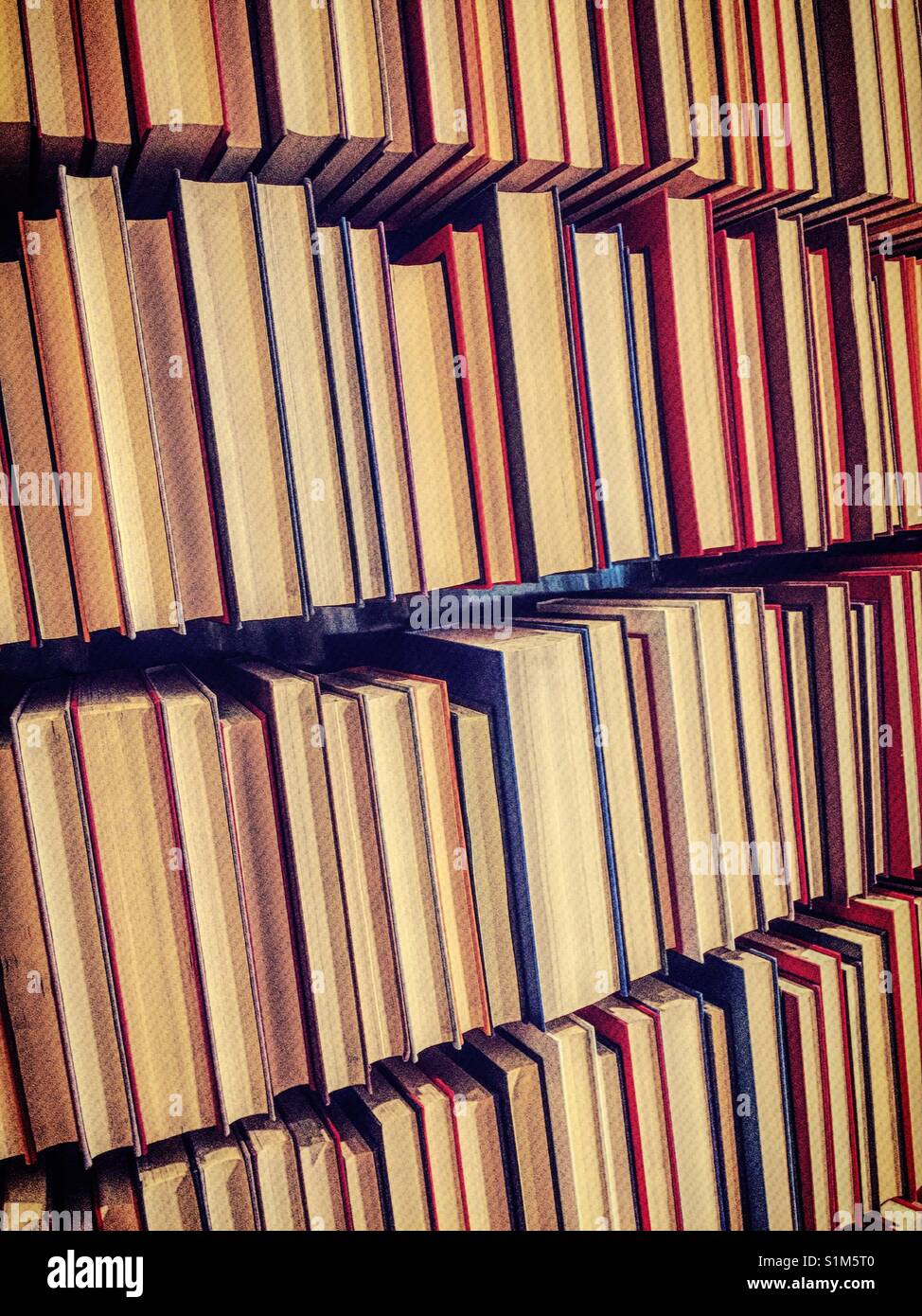 Books neatly placed on shelves Stock Photo - Alamy