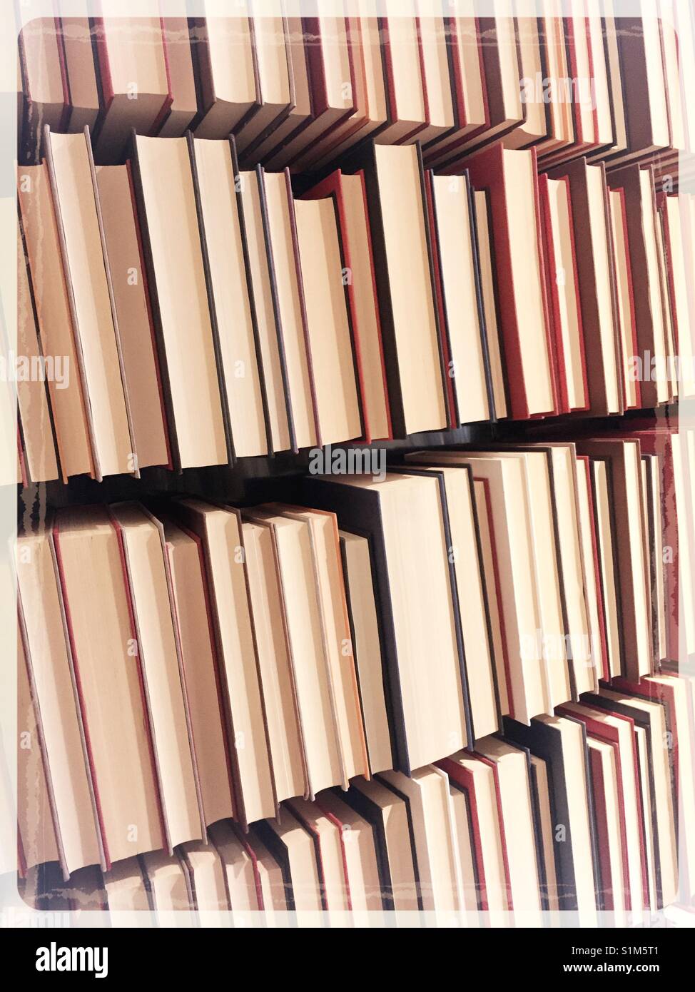 Books neatly placed on shelves Stock Photo - Alamy