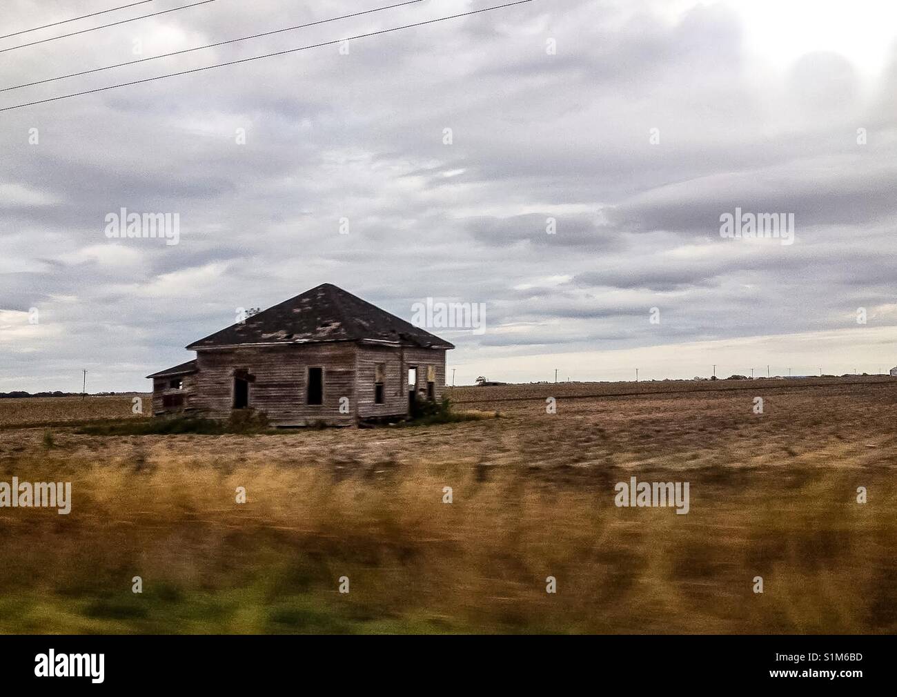 An old abandoned house in a field Stock Photo - Alamy