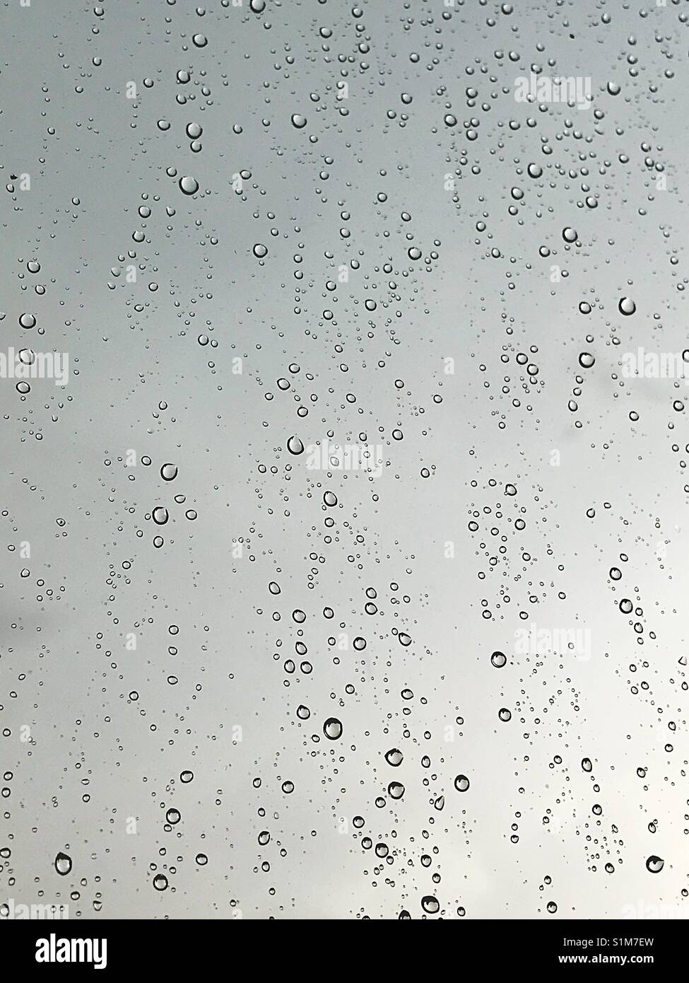 Raindrops falling at the window hi-res stock photography and images - Alamy