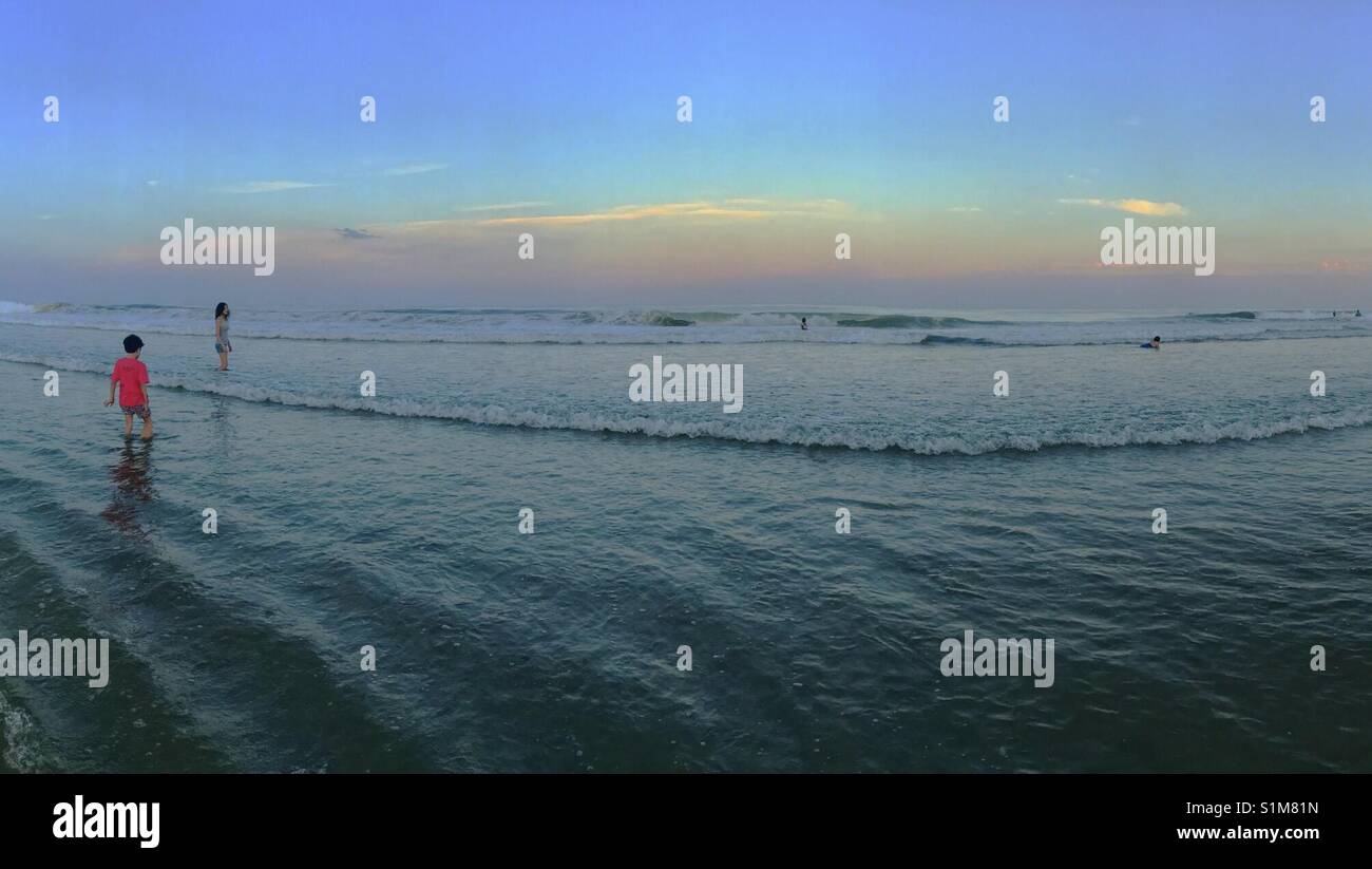 Go the beach at sunset Stock Photo - Alamy