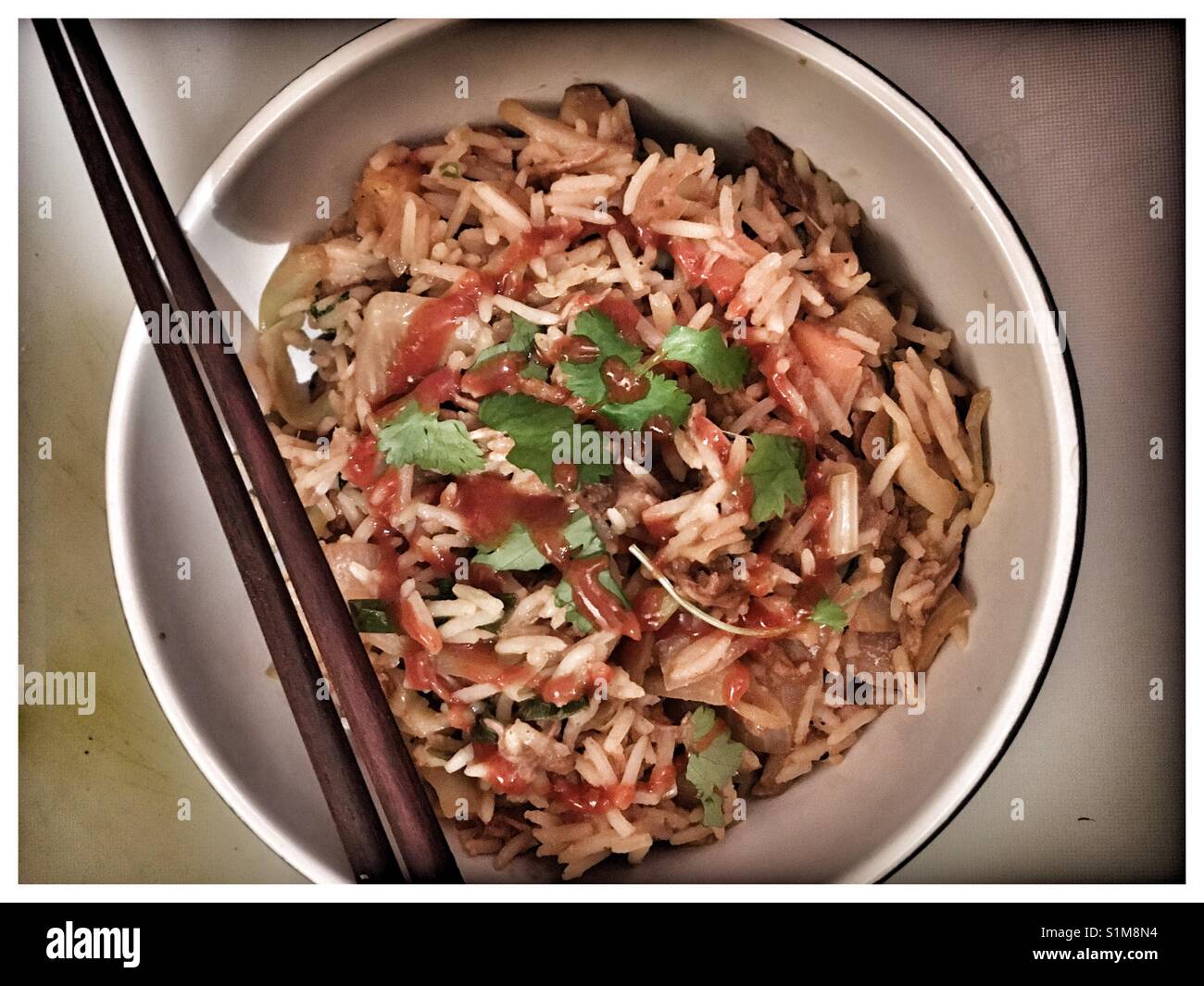 Pork Rib, Peanut and Vegetable fried rice with Sriracha Stock Photo - Alamy