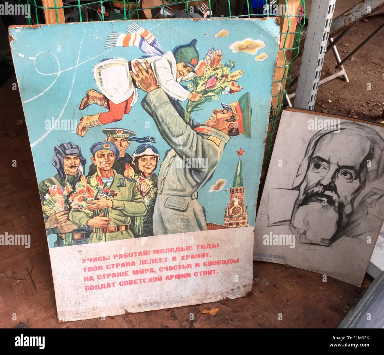 Soviet era posters for sale at Udelnaya flea market St Petersburg ...