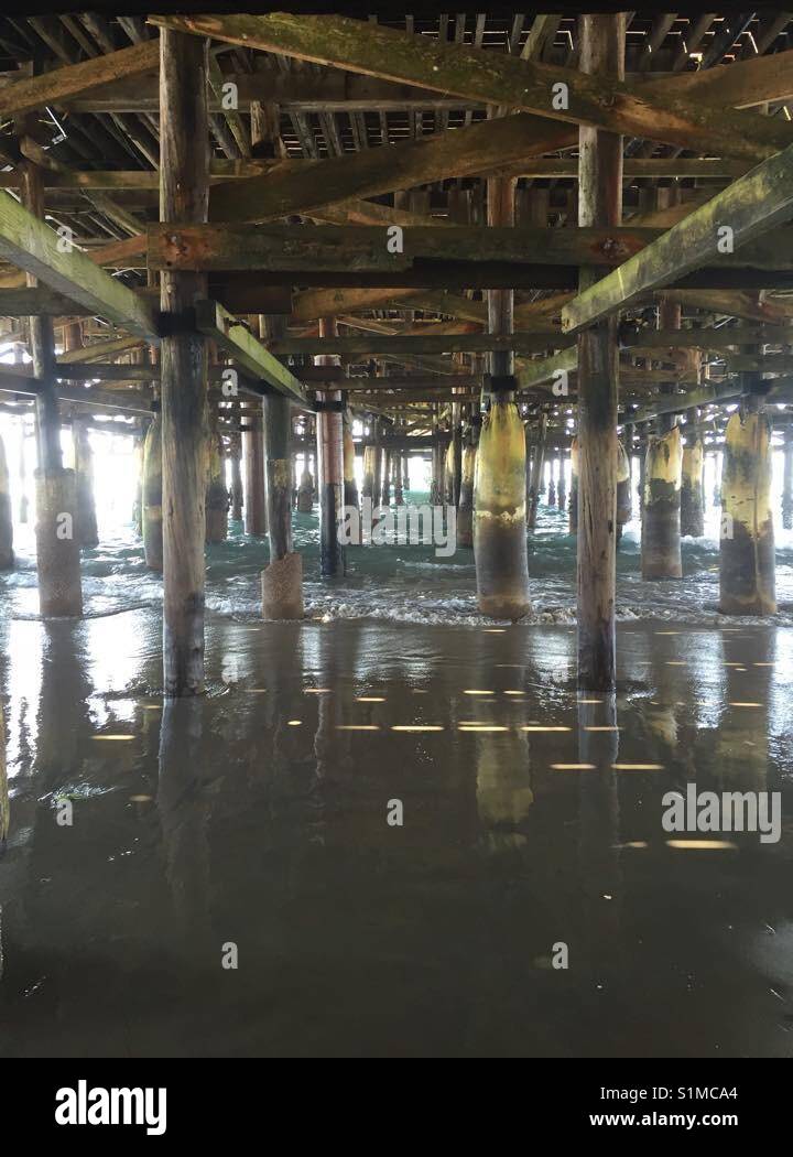 Underneath a pier Stock Photo - Alamy