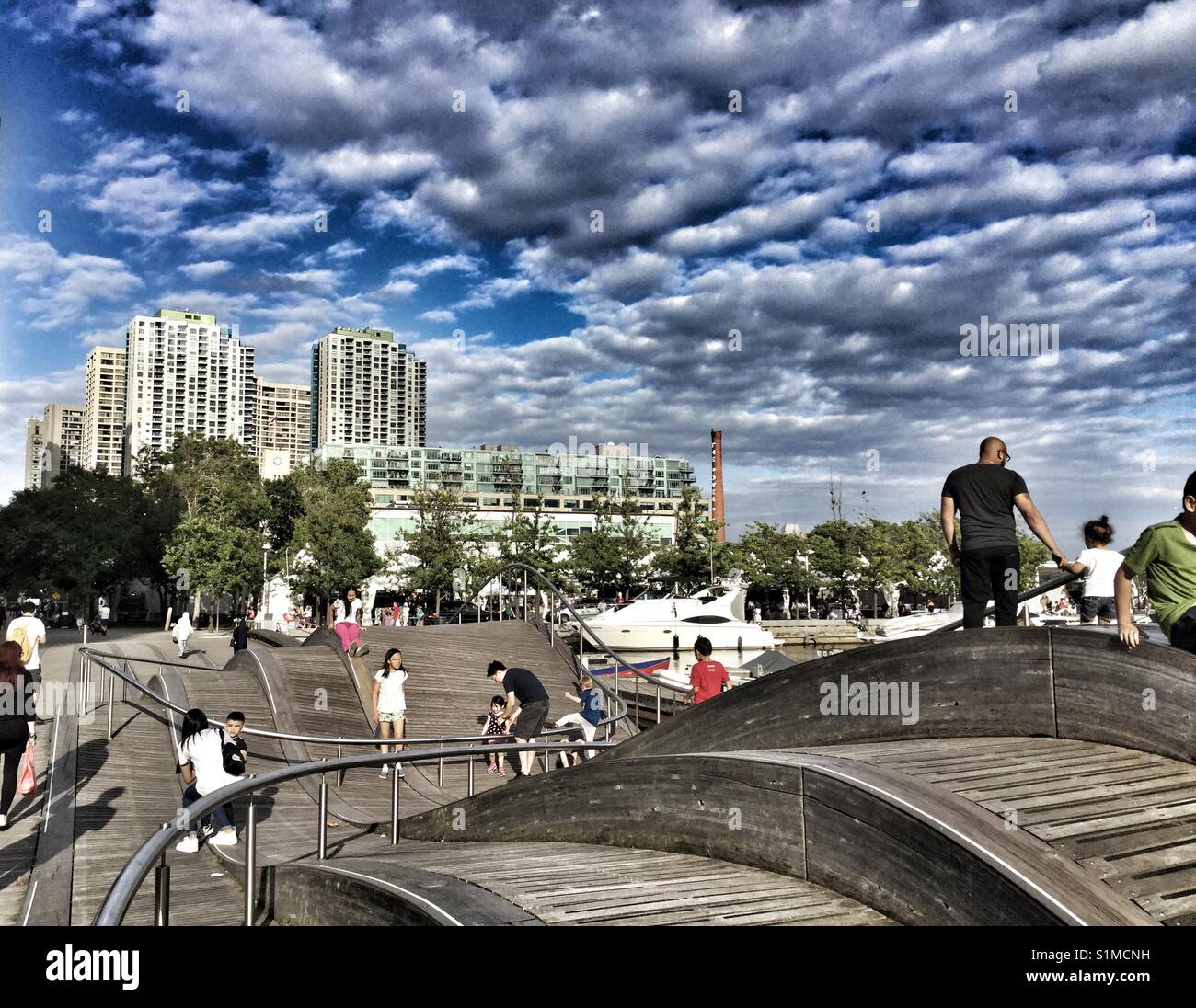 People walking on the wave deck at Harbourfront in Toronto Stock Photo ...