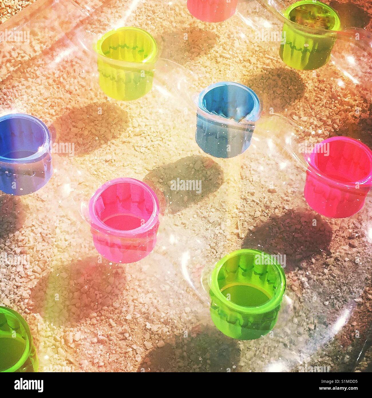 Close-up of a transparent colourful inflatable water air mattress on ...