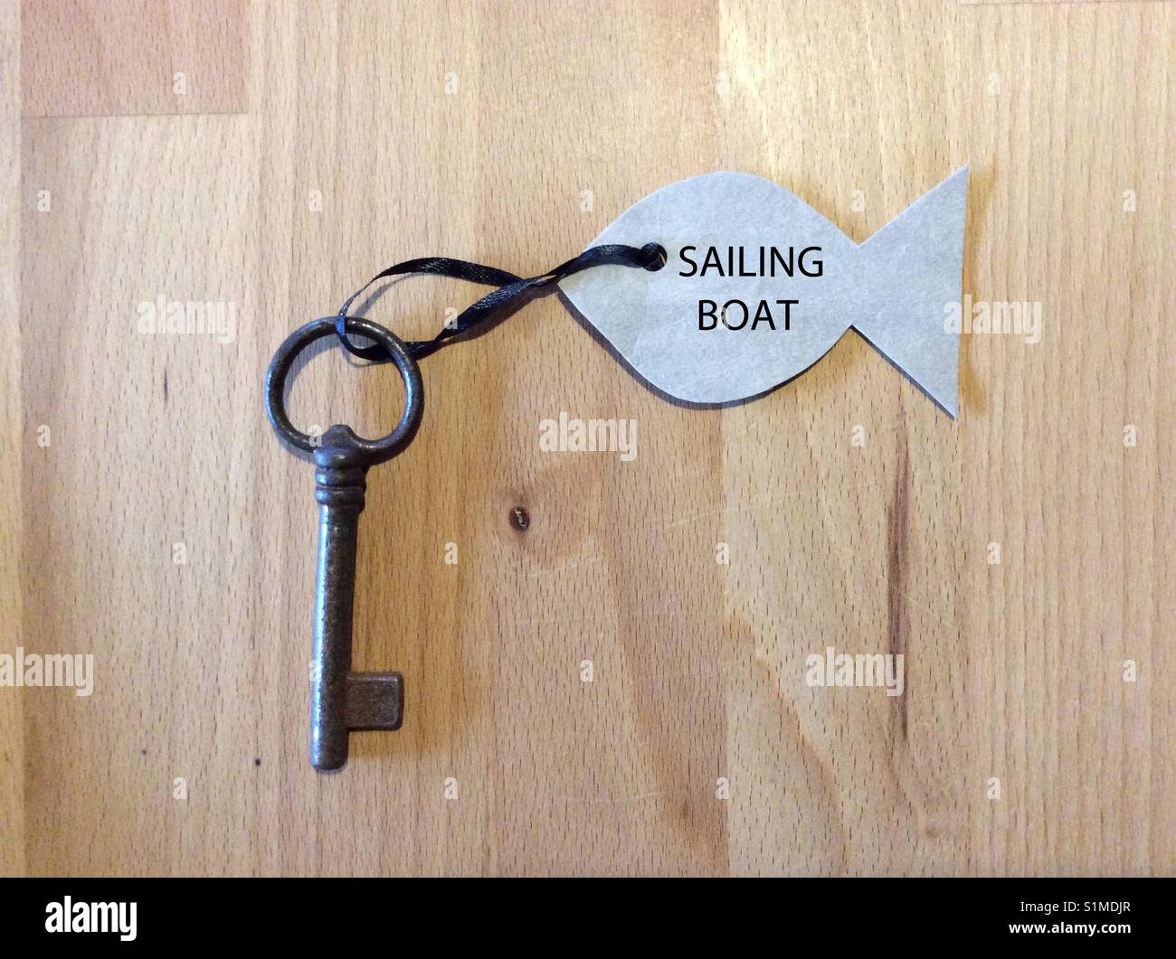 Vintage key and keyfob to sailing boat Stock Photo - Alamy