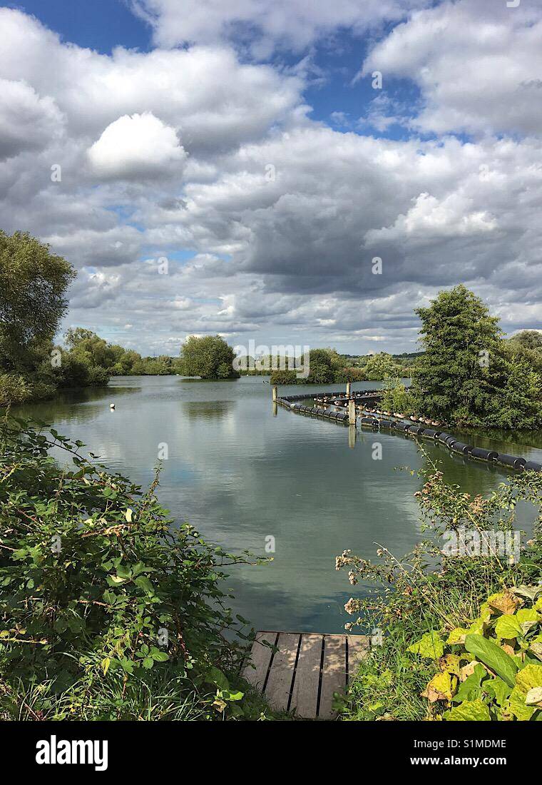 A view of Holyfield Weir, River Lee Country Park, Essex. Clouds and ...