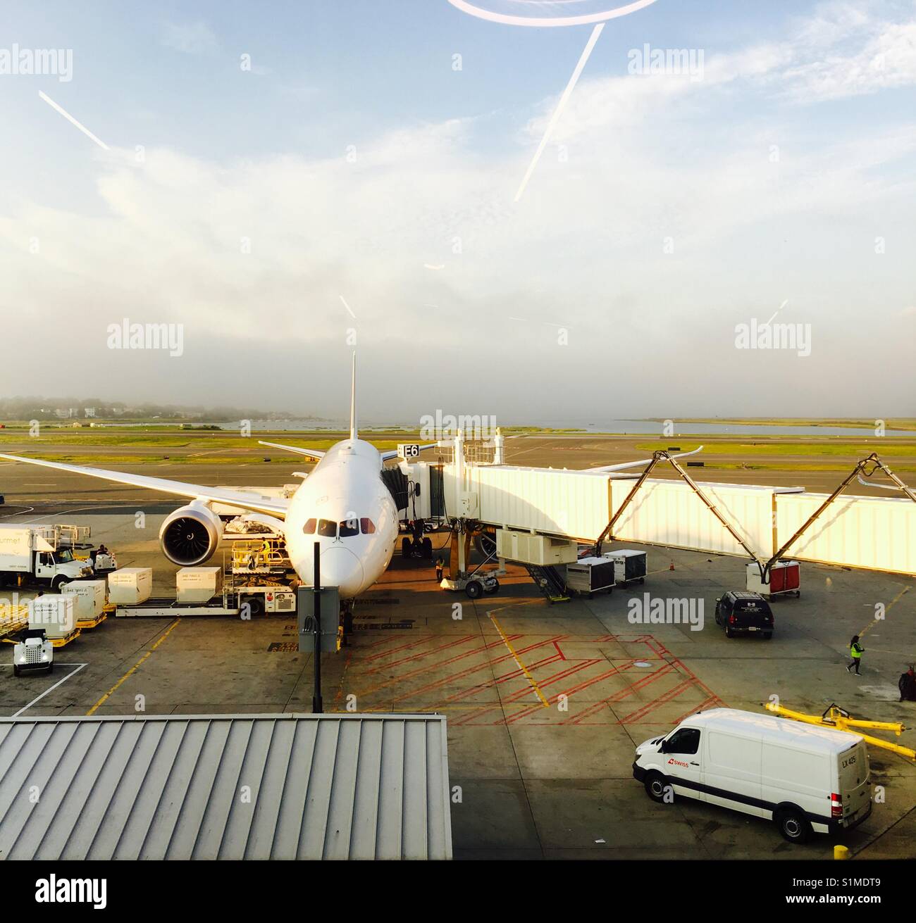 Jet airplane being serviced and prepared for takeoff at Boston Logan ...