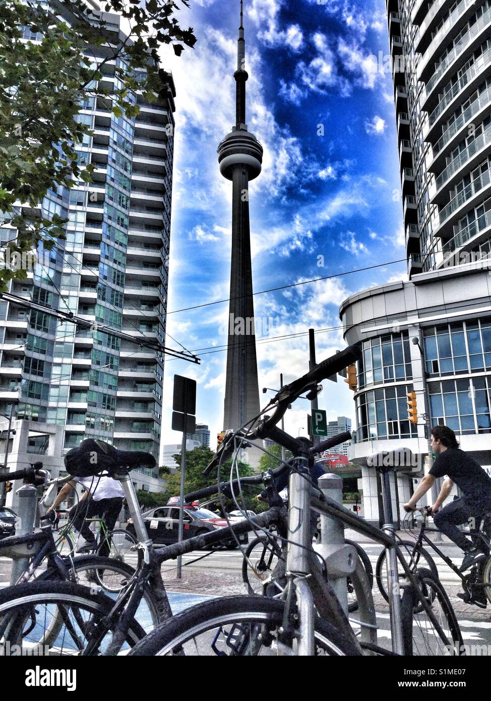 Toronto's CN Tower seen between two buildings Stock Photo - Alamy