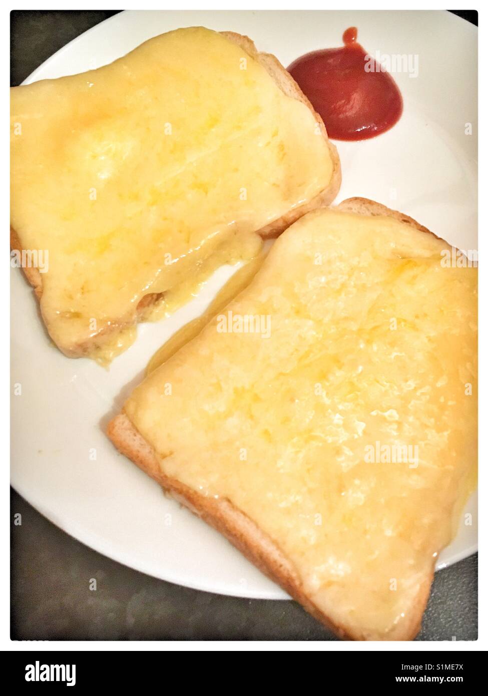 The Ultimate Cheese on Toast with Tomato Ketchup Stock Photo - Alamy