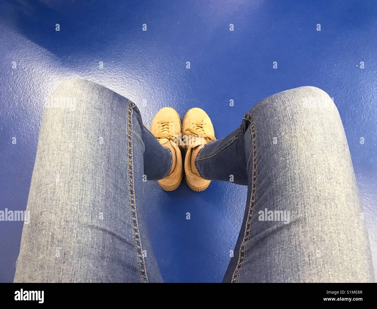 Sitting woman's legs. Subjective camera Stock Photo - Alamy