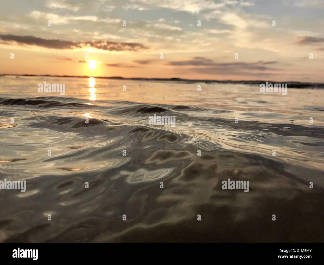 Calm water at sunset hi-res stock photography and images - Alamy
