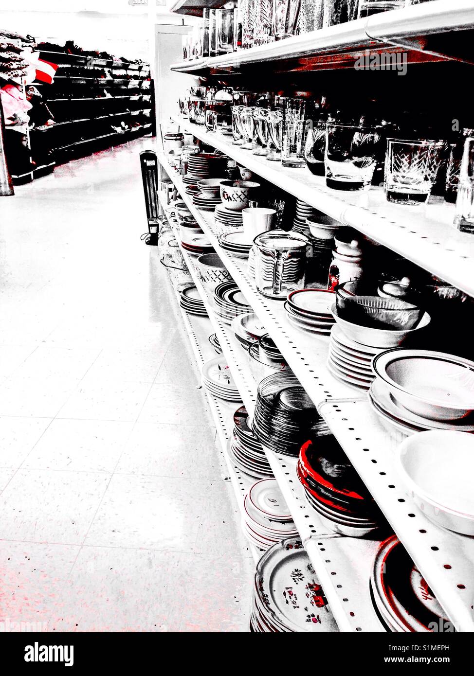 Red color drop photo of dishware display at thrift store Stock Photo ...