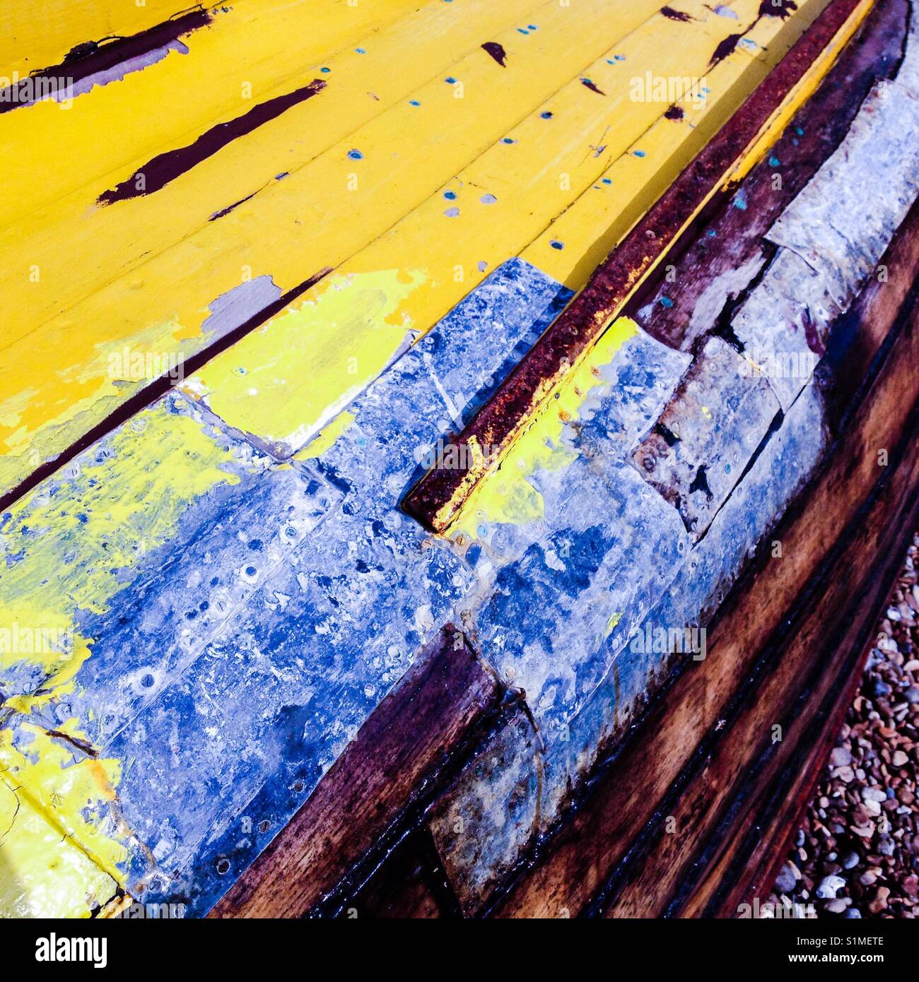 Zinc plates on the upturned hull of an old wooden fishing boat Stock ...
