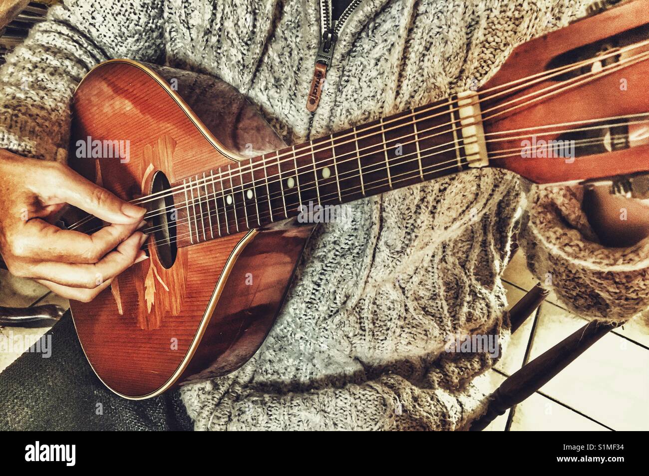 Woman playing a mandolin Stock Photo - Alamy