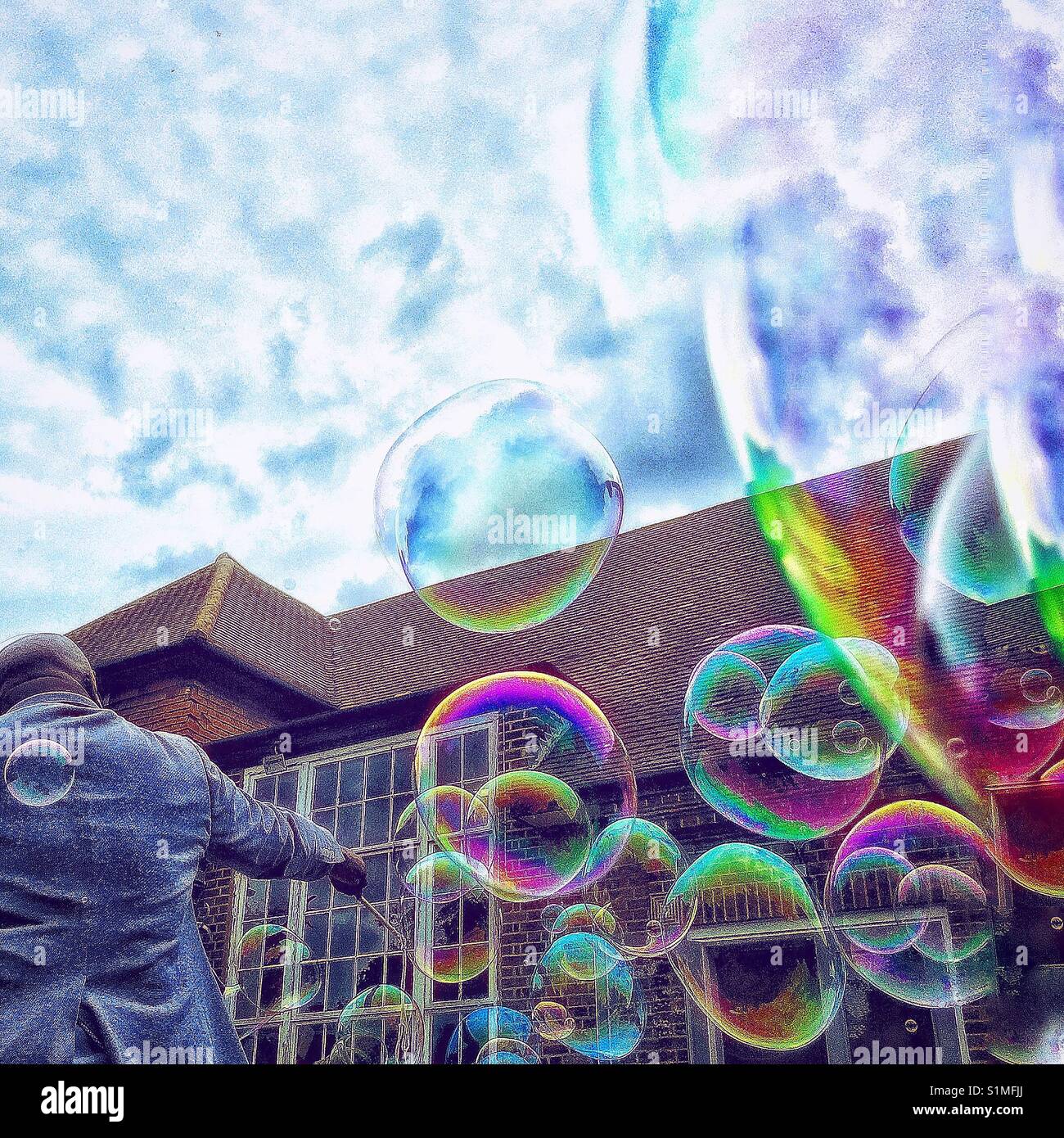 A man making bubbles Stock Photo - Alamy