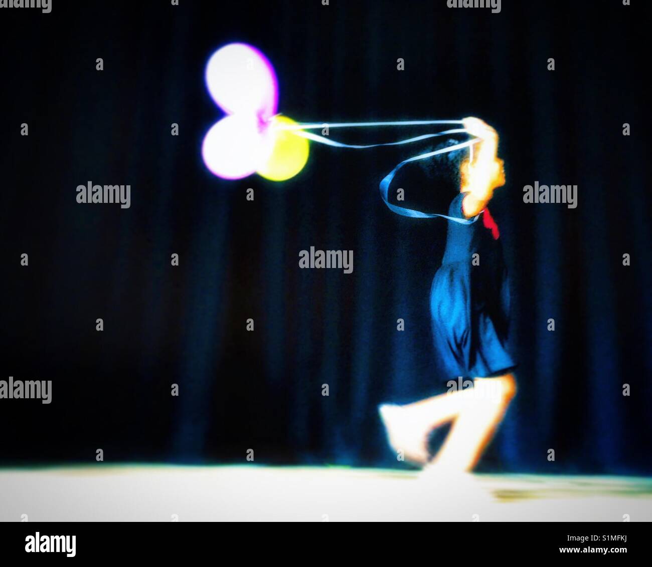 Young girl running with balloons Stock Photo - Alamy