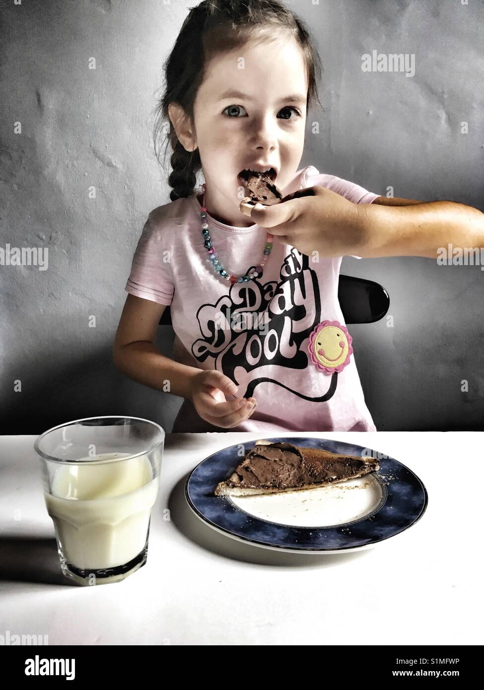 Girl eating chocolate bar hi-res stock photography and images - Alamy
