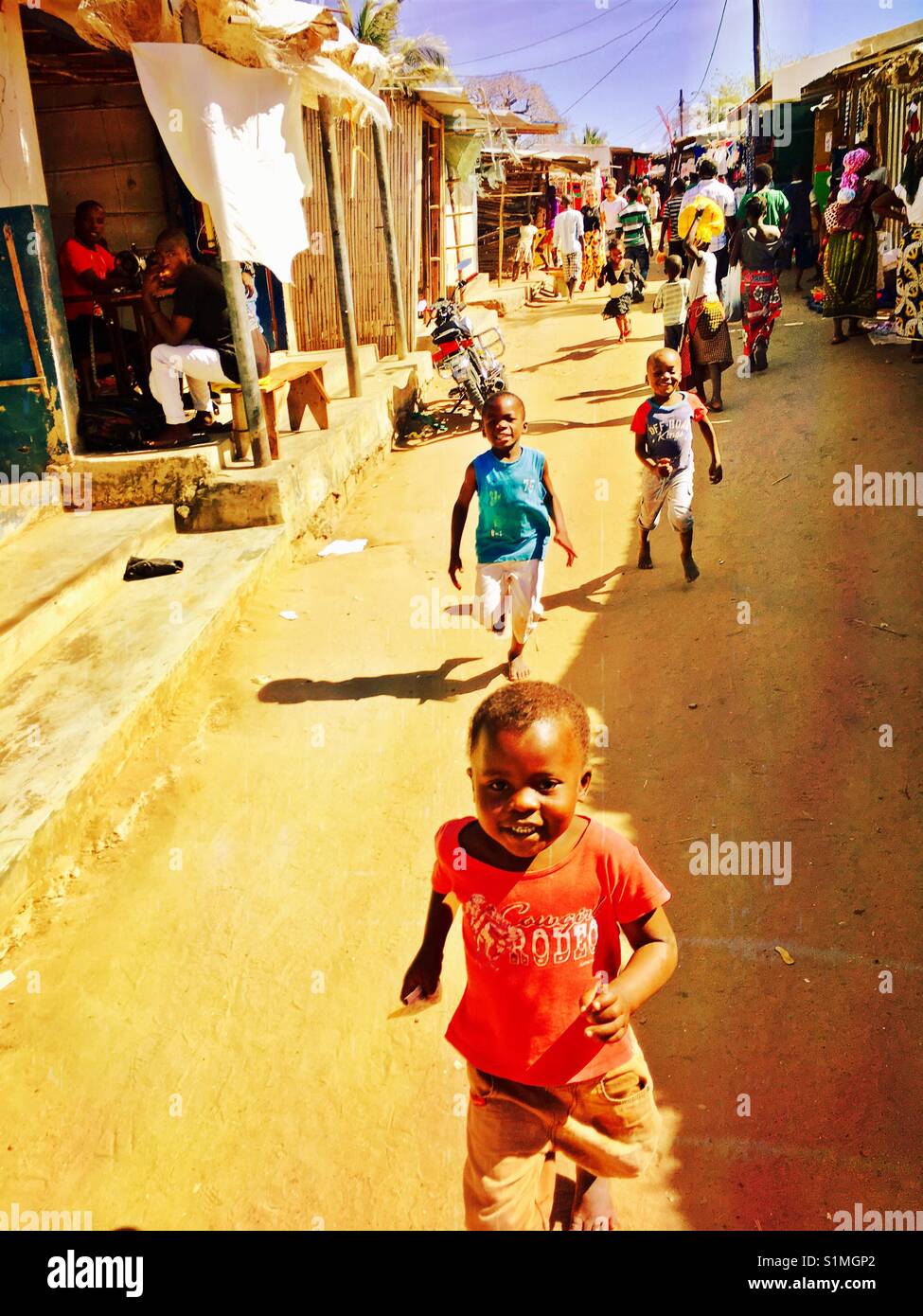 Children running street africa hi-res stock photography and images - Alamy