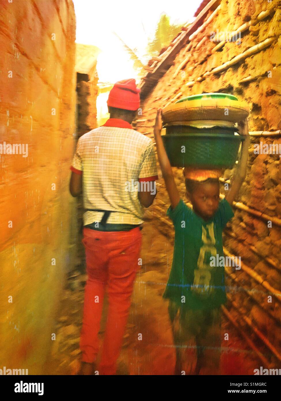 Boy with bucket on head hi-res stock photography and images - Alamy