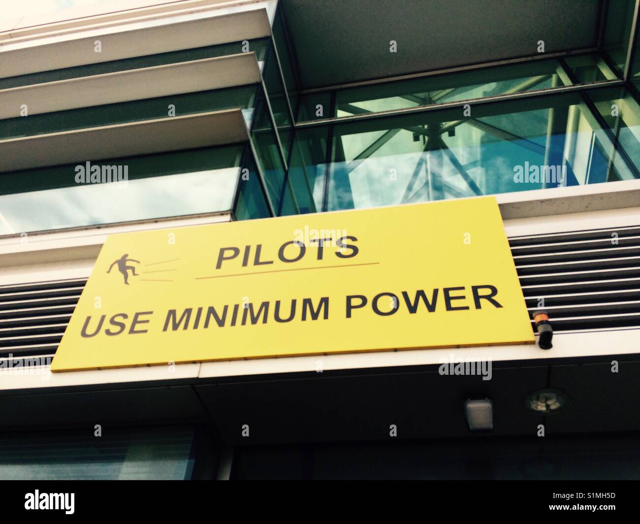 Pilots use minimum power. Sign signage at Dublin Airport Ireland Stock ...
