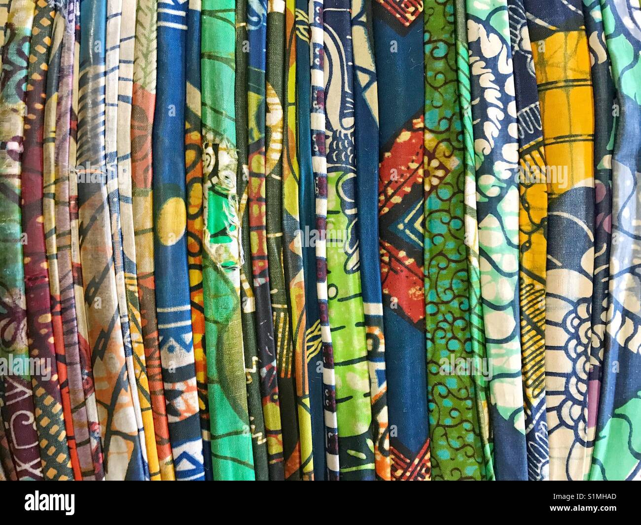 Stack of colourful patterned fabrics create beautiful background Stock ...