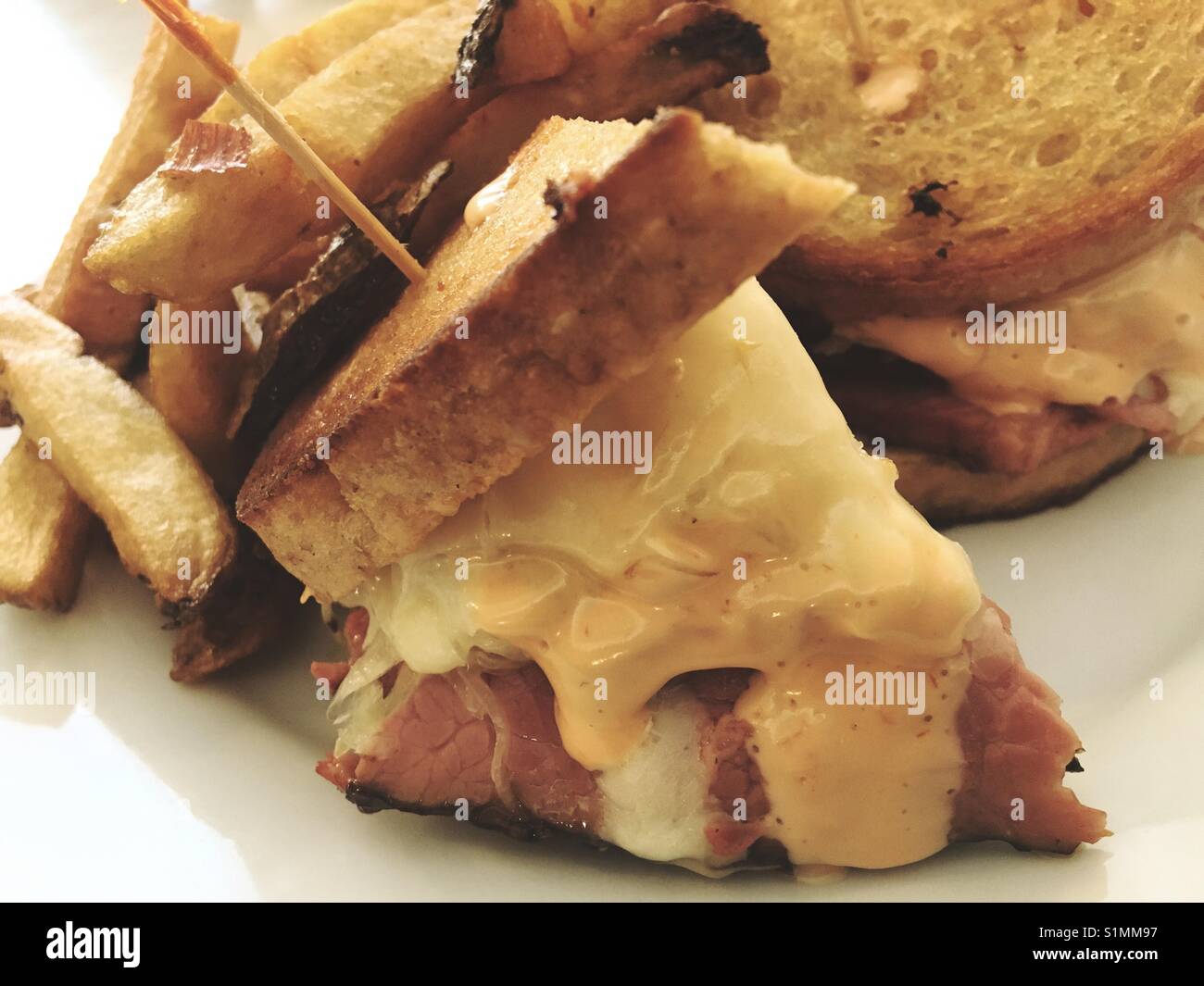 Reuben sandwich with house cut fries Stock Photo - Alamy