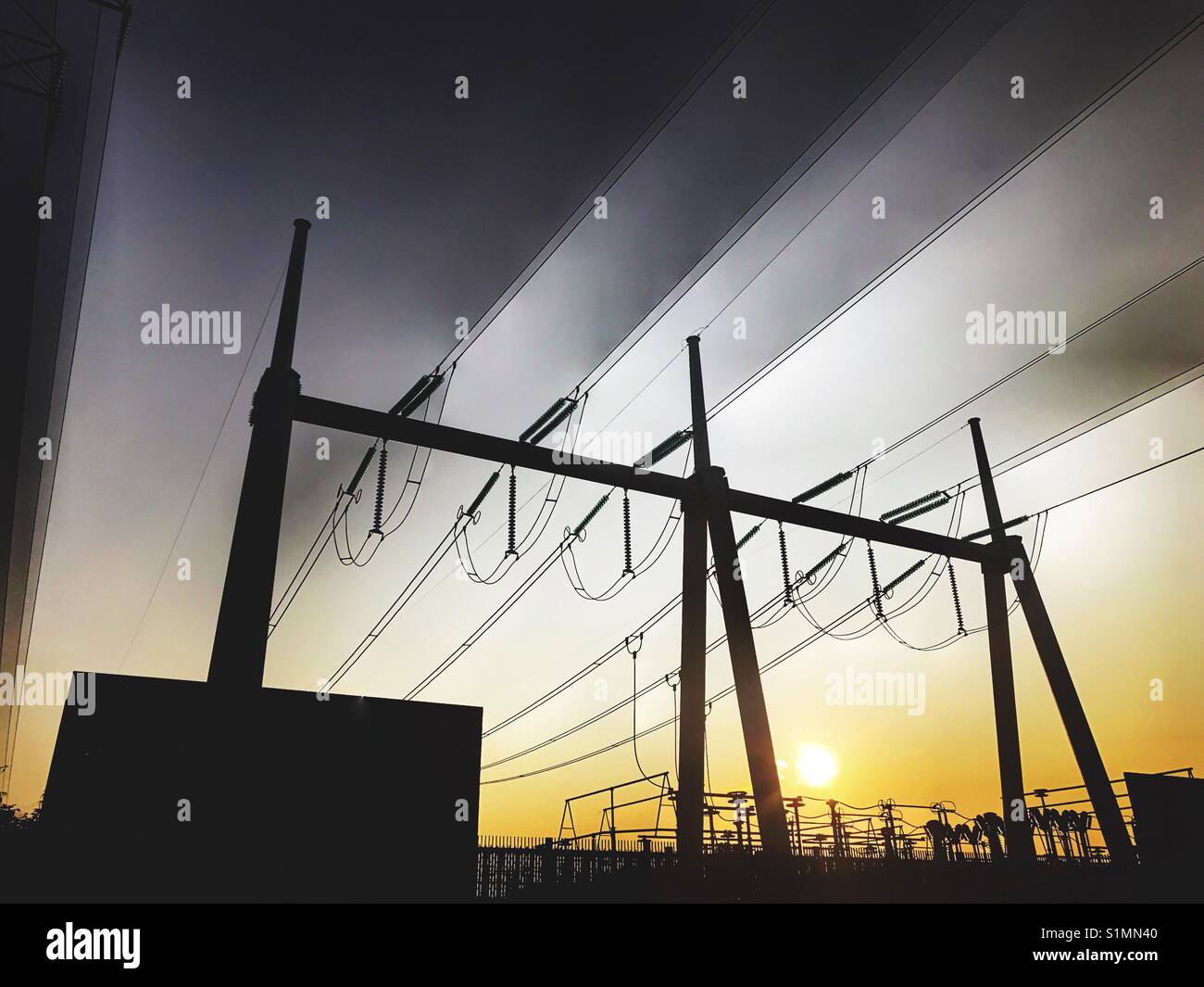 Power lines at sunset Stock Photo - Alamy