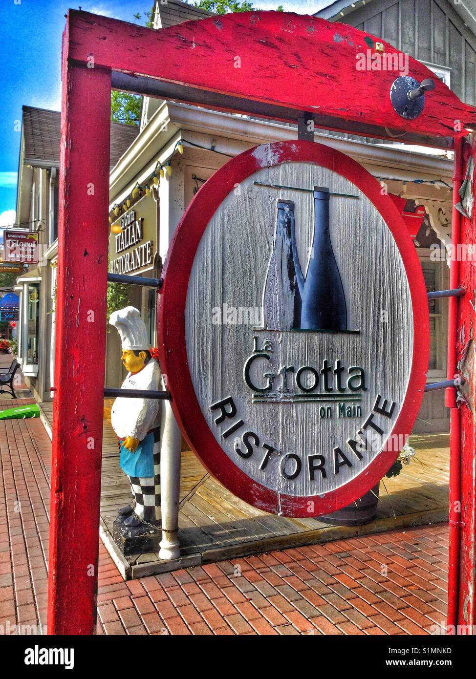 Bold red sign for an Italian restaurant Stock Photo - Alamy