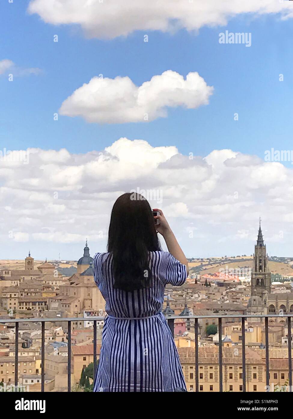Woman taking photos at the viewpoint over the city. Toledo. Spain Stock ...