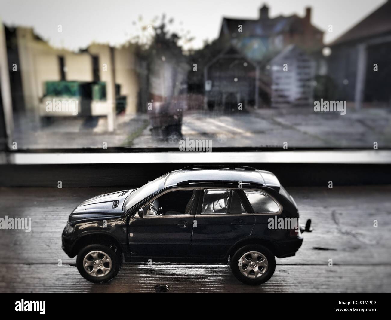 Toy car on windowsill Stock Photo - Alamy