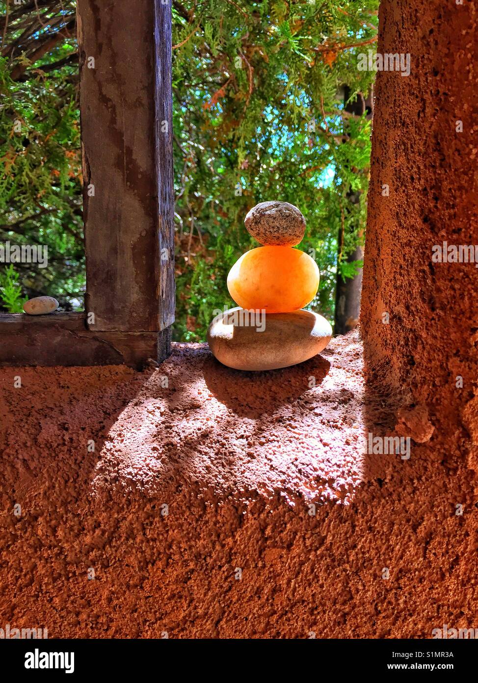 Zen Rocks on Adobe Wall Stock Photo - Alamy