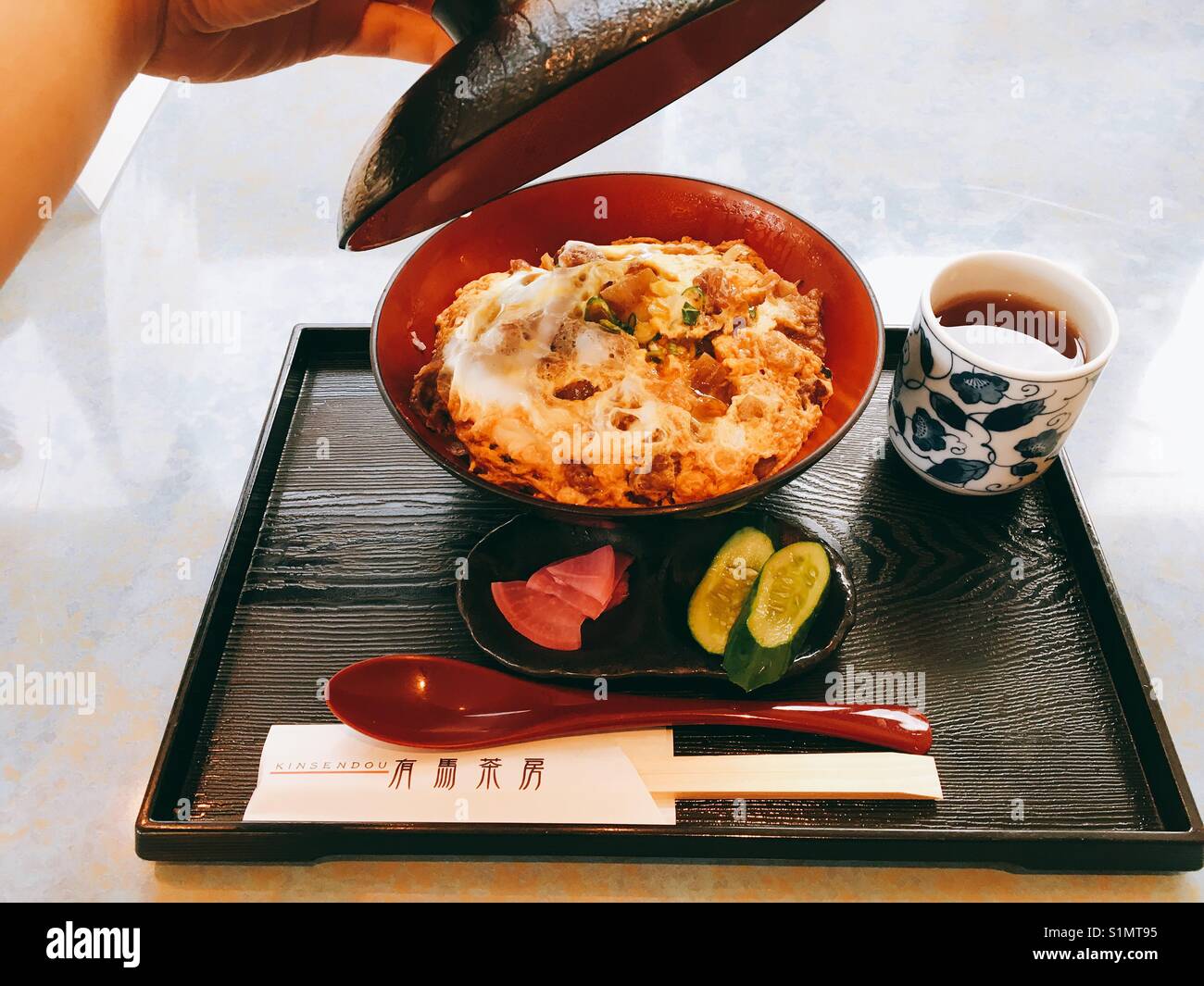 Trying Japanese local food Stock Photo - Alamy