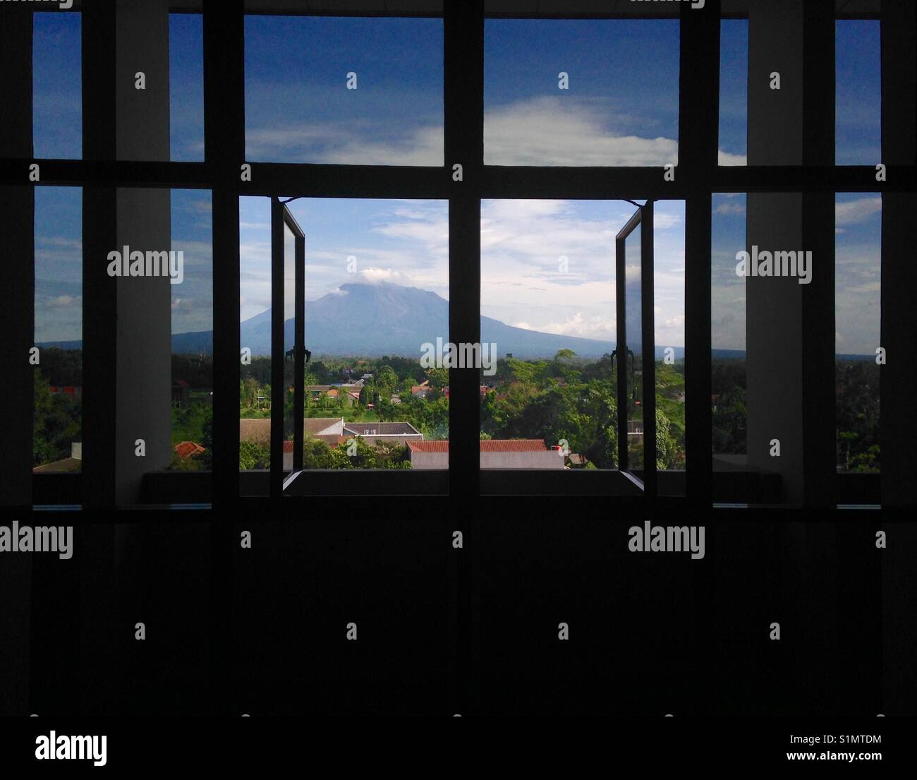 Merapi mountain view from window Stock Photo - Alamy